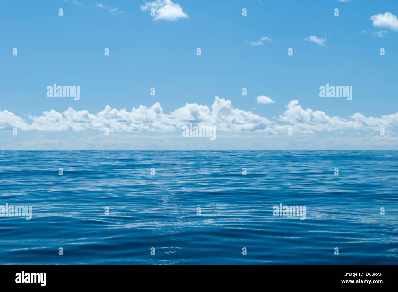 big calm sea with blue skies Stock Photo - Alamy
