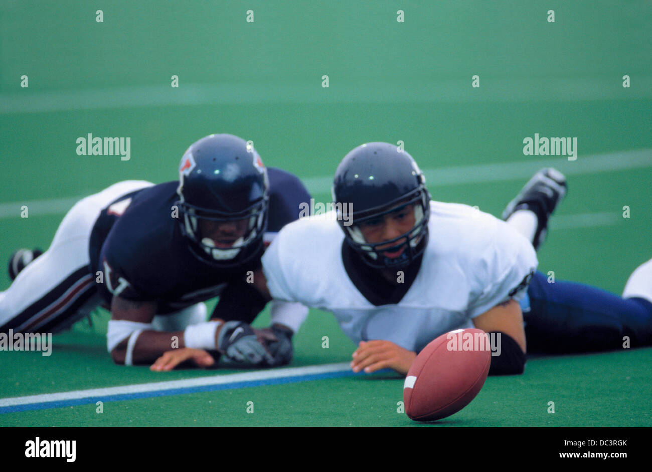 Football helmet collision hi-res stock photography and images - Alamy