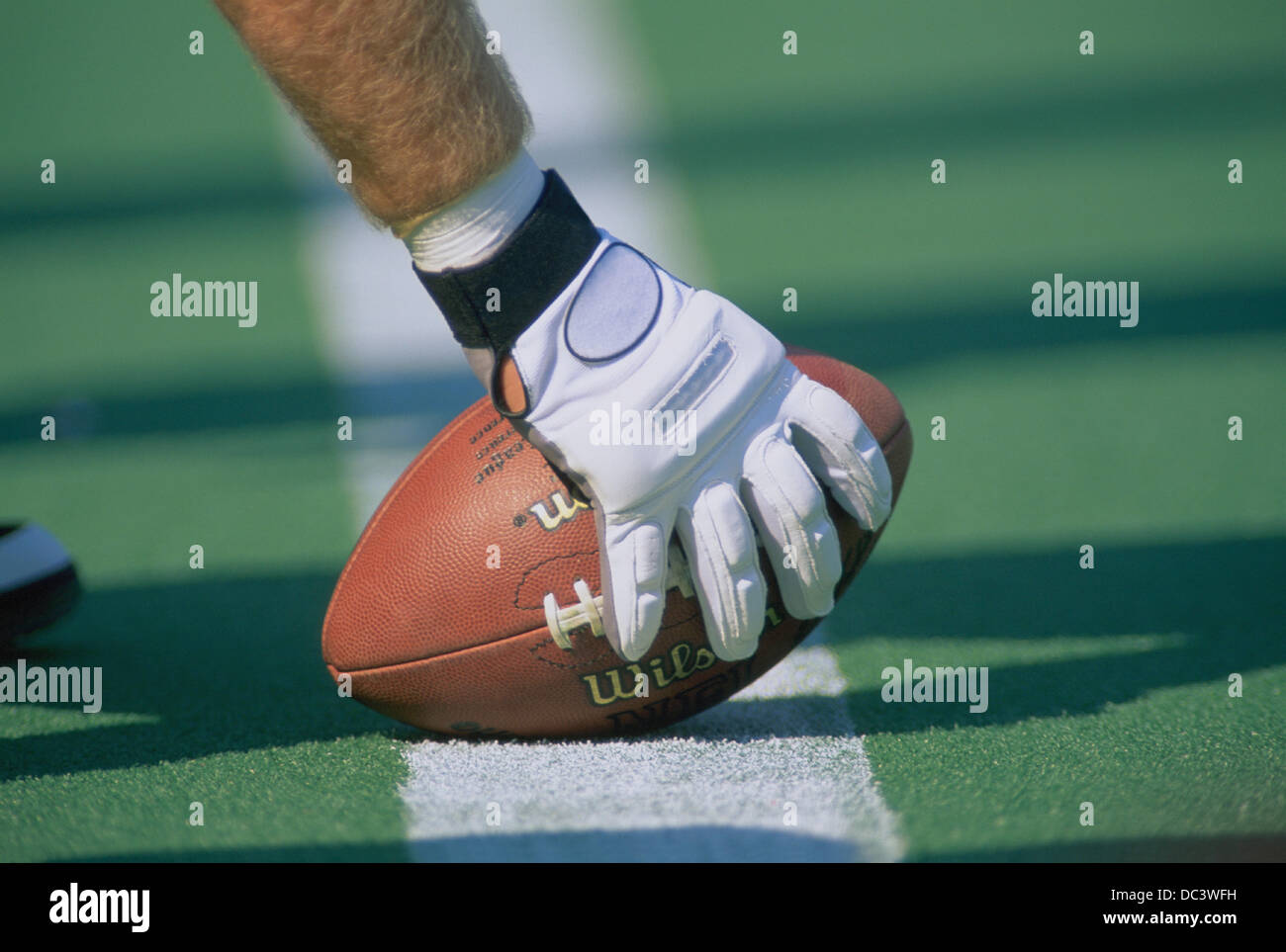 Football center snap ball hi-res stock photography and images - Alamy