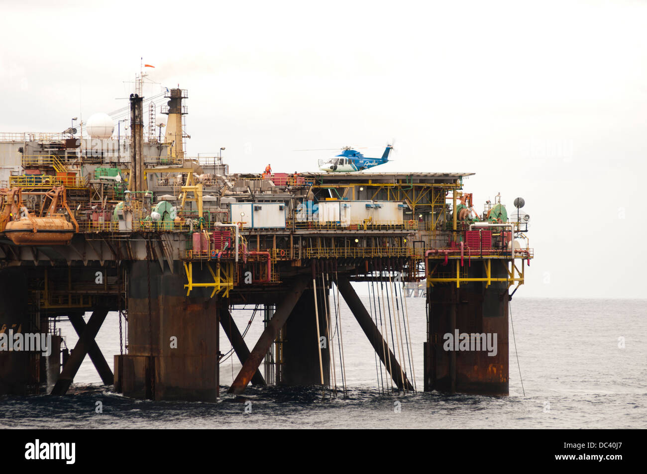 Offshore oil rig Petrobras VIII with helicopter landed/landing on deck ...