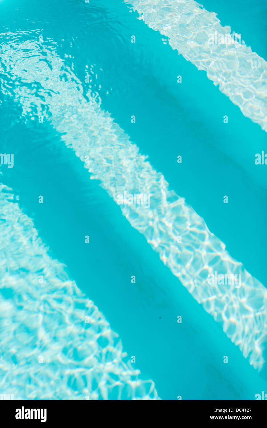 Steps in swimming pool in the sun Stock Photo - Alamy