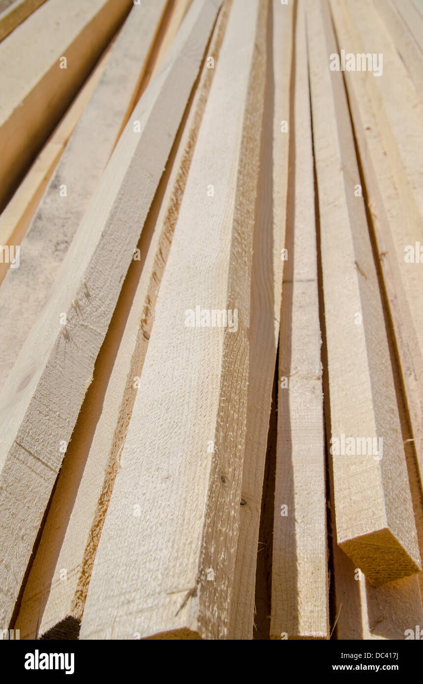 Stacks of wood building planks in warehouse Stock Photo - Alamy