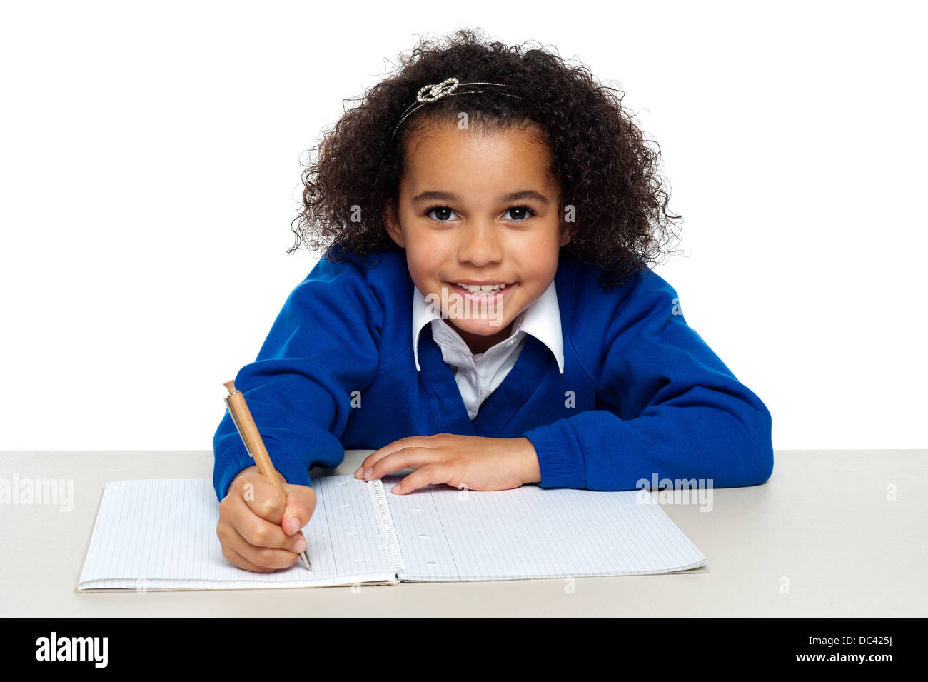 Young girl writing copying notes from the whiteboard Stock Photo - Alamy