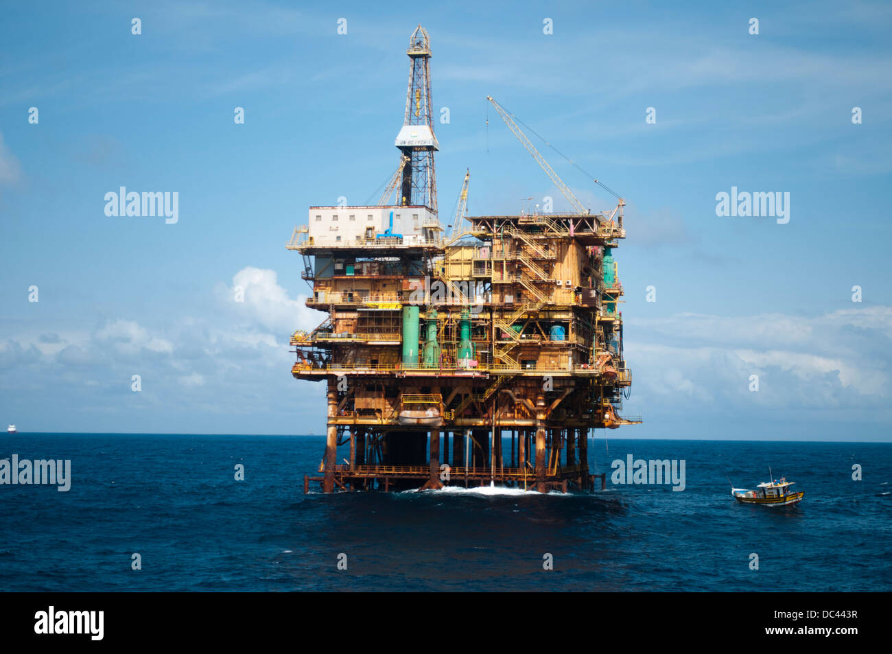 small fishing boat moored on offshore oil rig PCH-01, working for ...