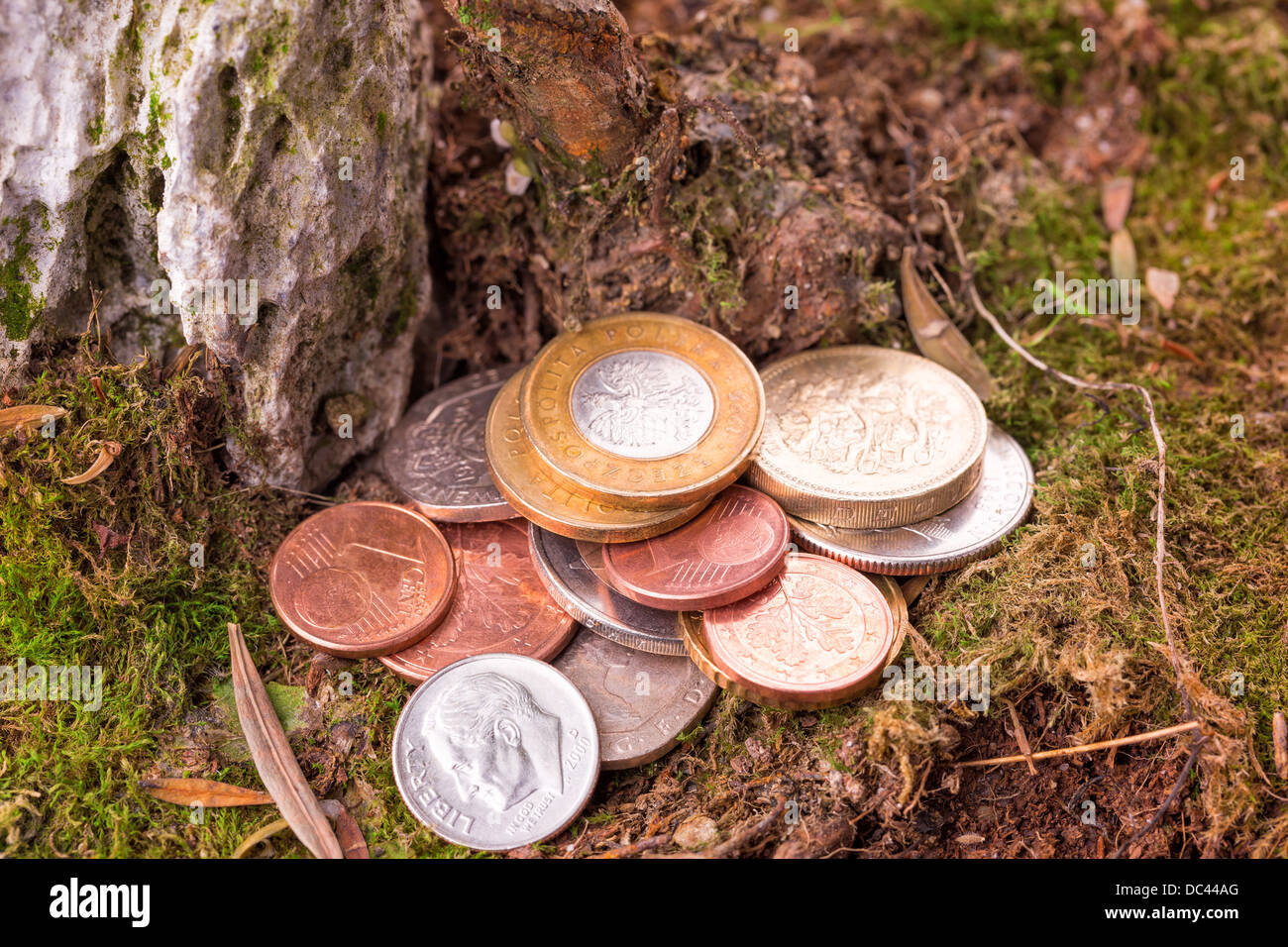 Different old coins stacked on the ground. Treasure concept Stock Photo ...