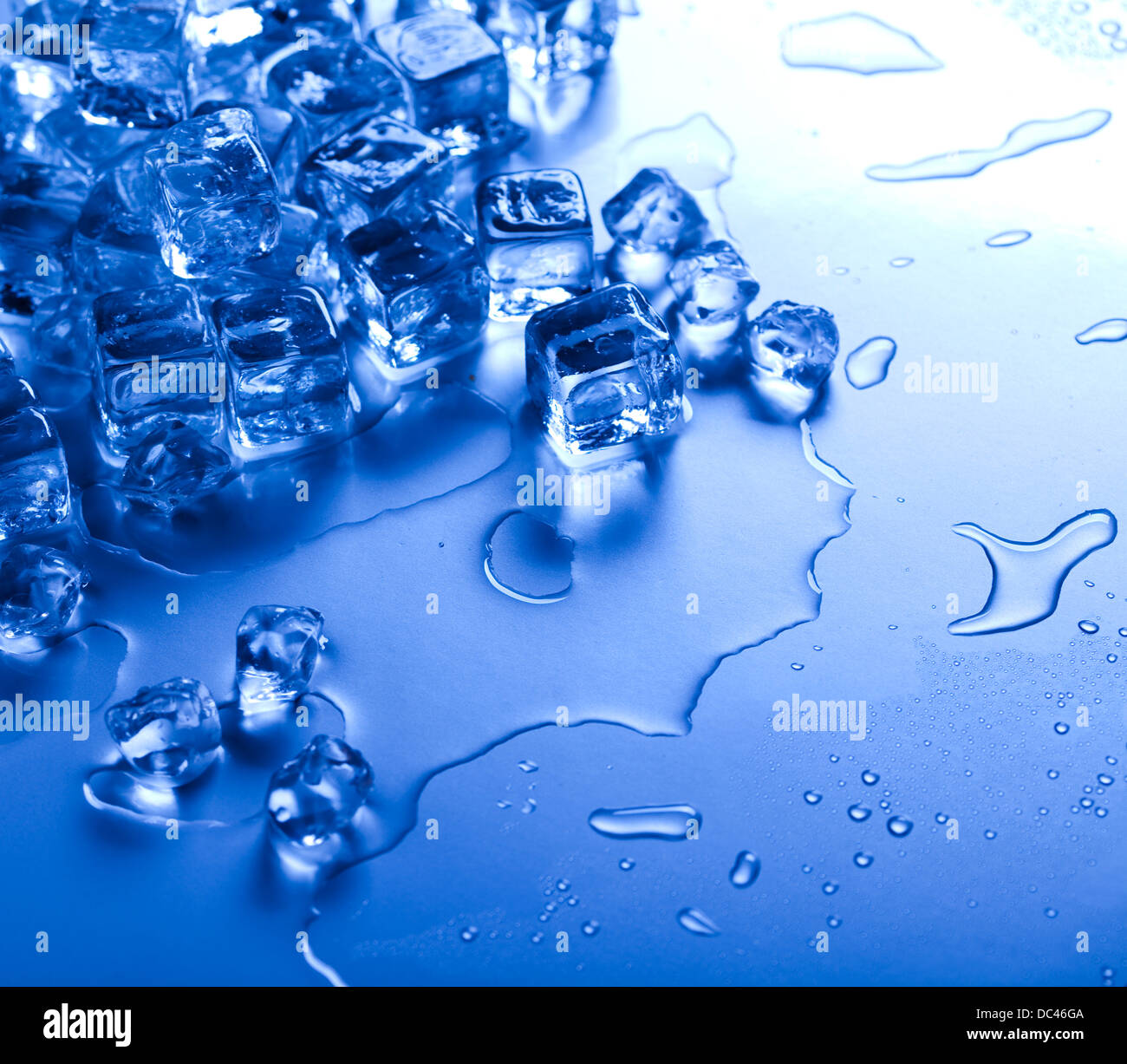 Ice cubes on blue background Stock Photo - Alamy