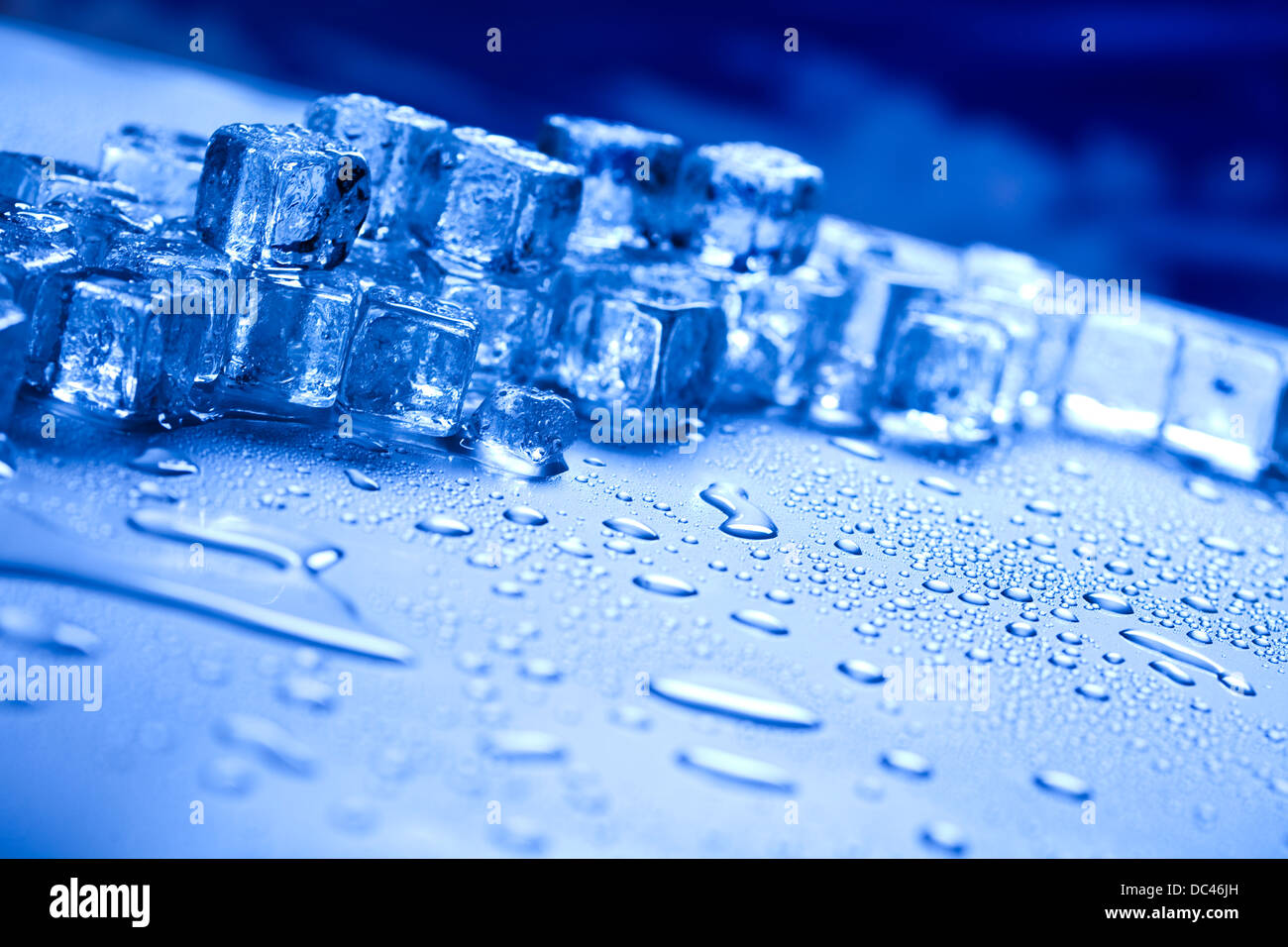 Ice cubes on blue background Stock Photo - Alamy