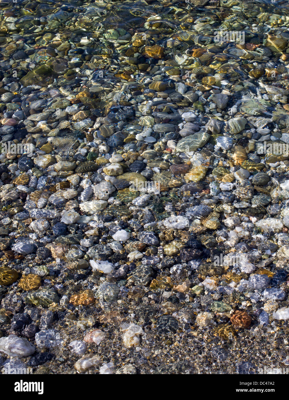 Sand gravel under sea in a beach Stock Photo - Alamy