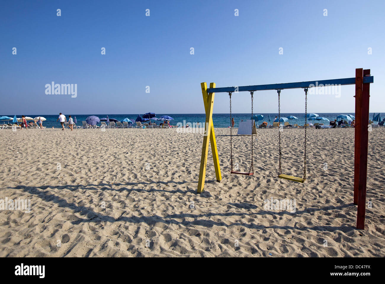 Baby swing at a beach in Greece Stock Photo - Alamy