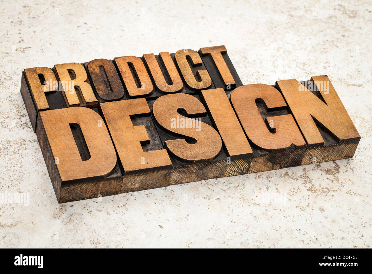 product design text in vintage letterpress wood type on a ceramic tile ...