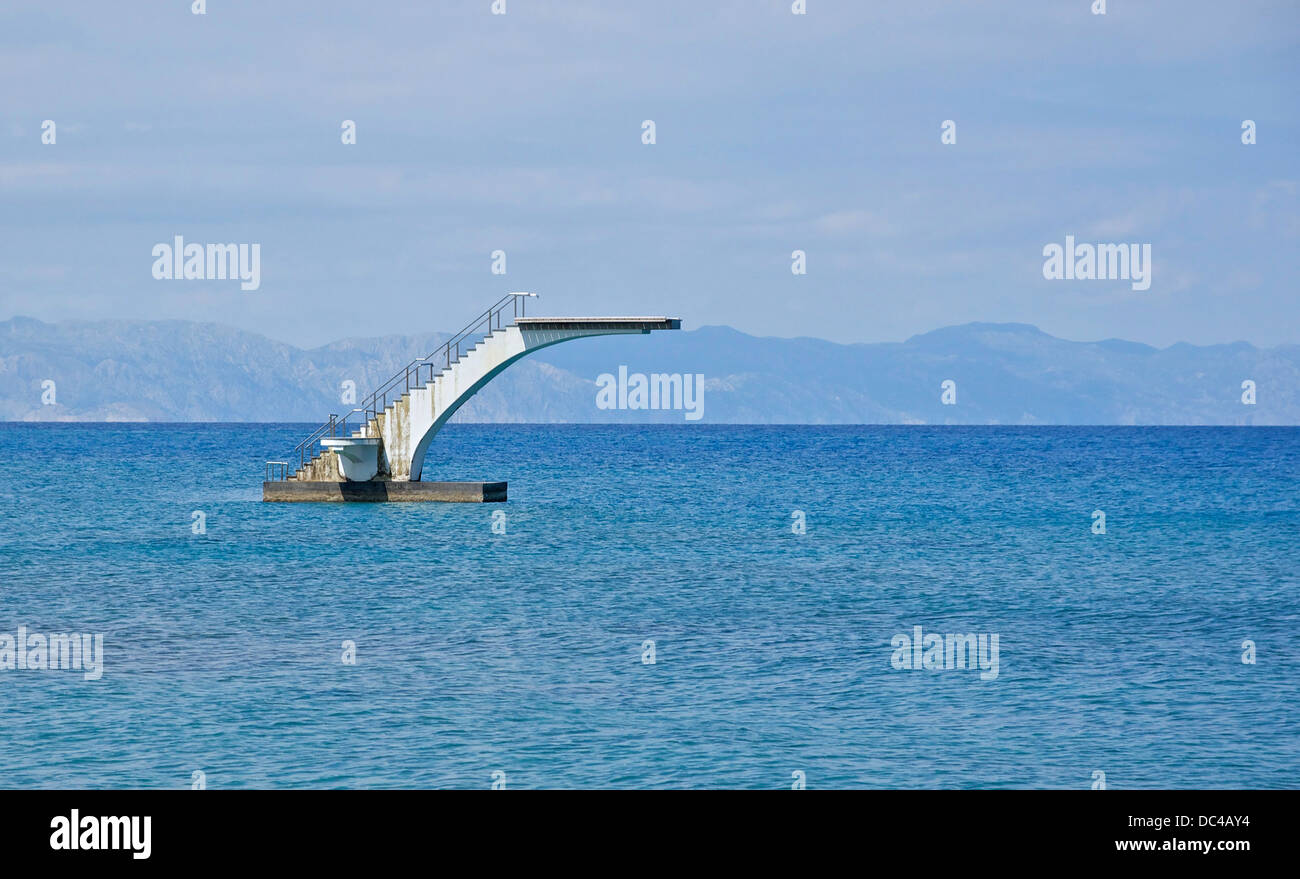 The spring tower at the main beach of Rhodes, Greece. In background ...