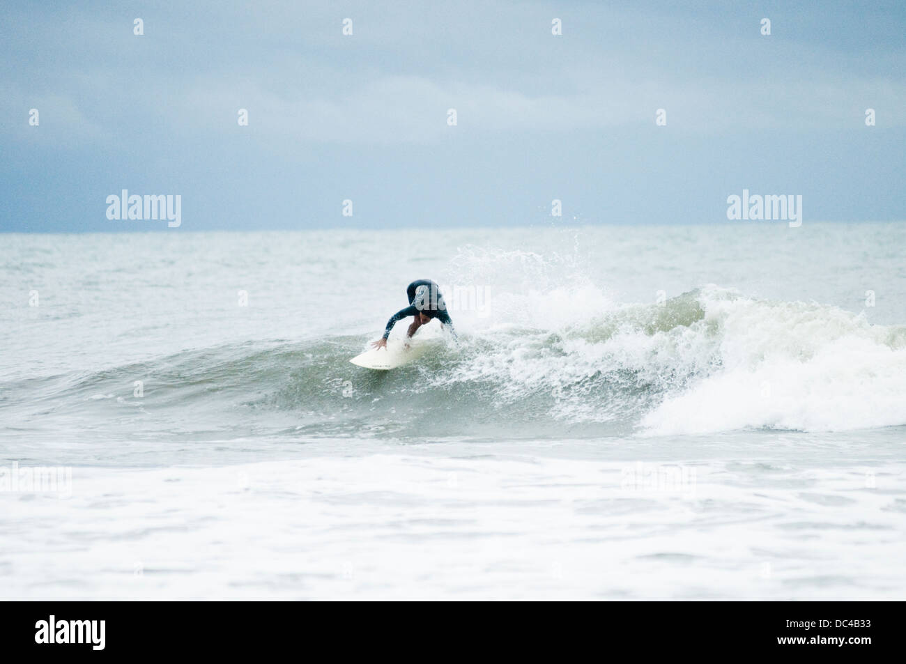 Local surfer in action at Caiobá Beach, Matinhos, Paraná state shore ...