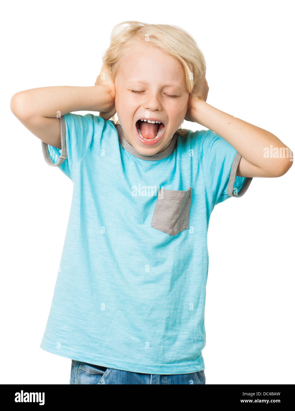 Young boy screams and covers ears Stock Photo - Alamy