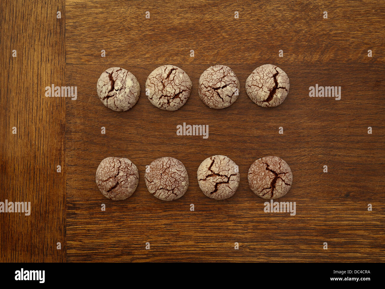 Chocolate cookies equal sign on wooden board Stock Photo - Alamy