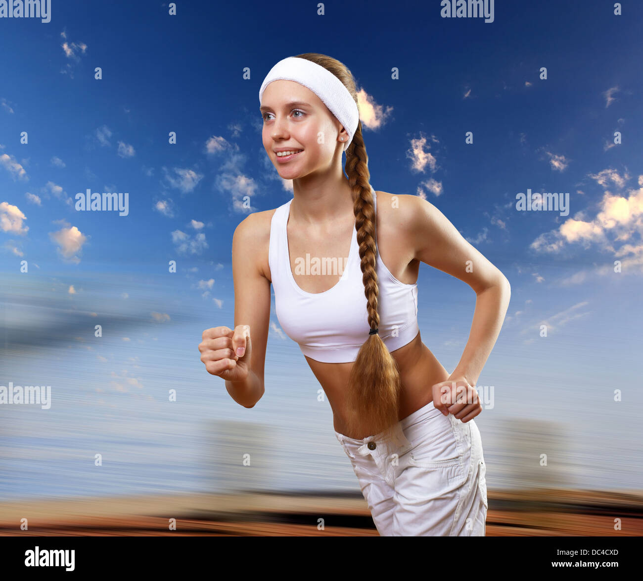 Young pretty woman in sport wear running Stock Photo - Alamy