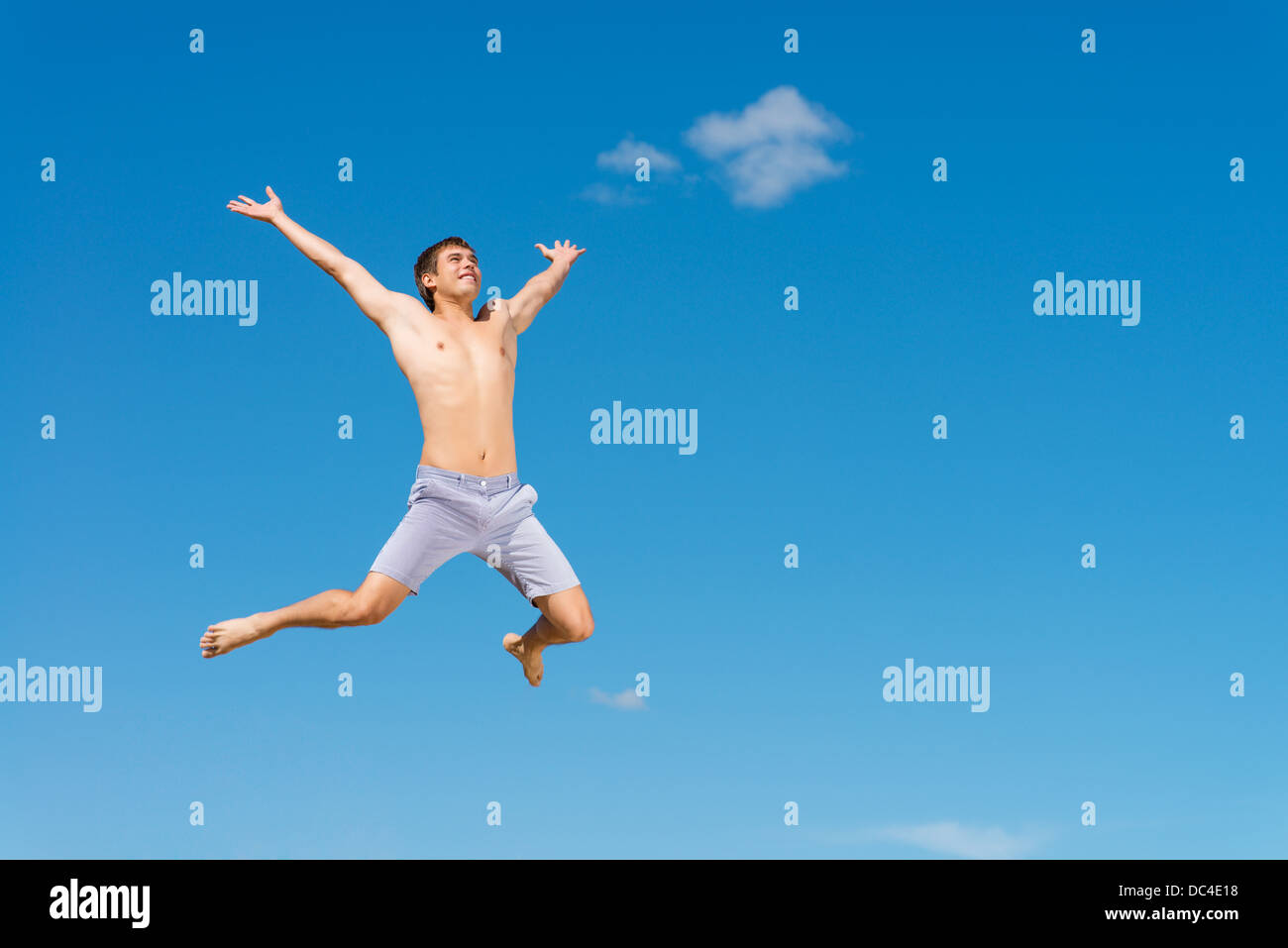 young man jumping Stock Photo - Alamy