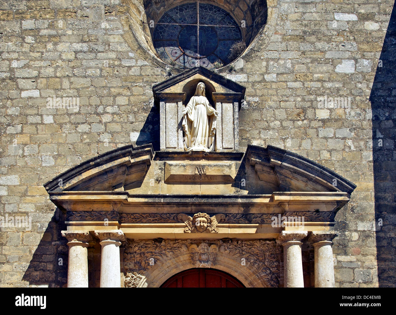 Pediment of the church "Notre-Dame de l'Assomption" in Domme, Dordogne ...