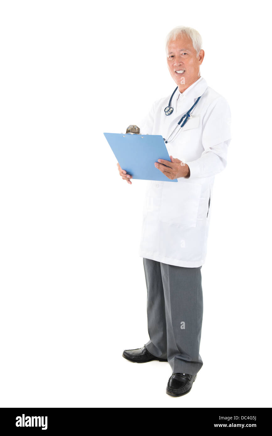 Full body Asian senior doctor reading medical report Stock Photo - Alamy