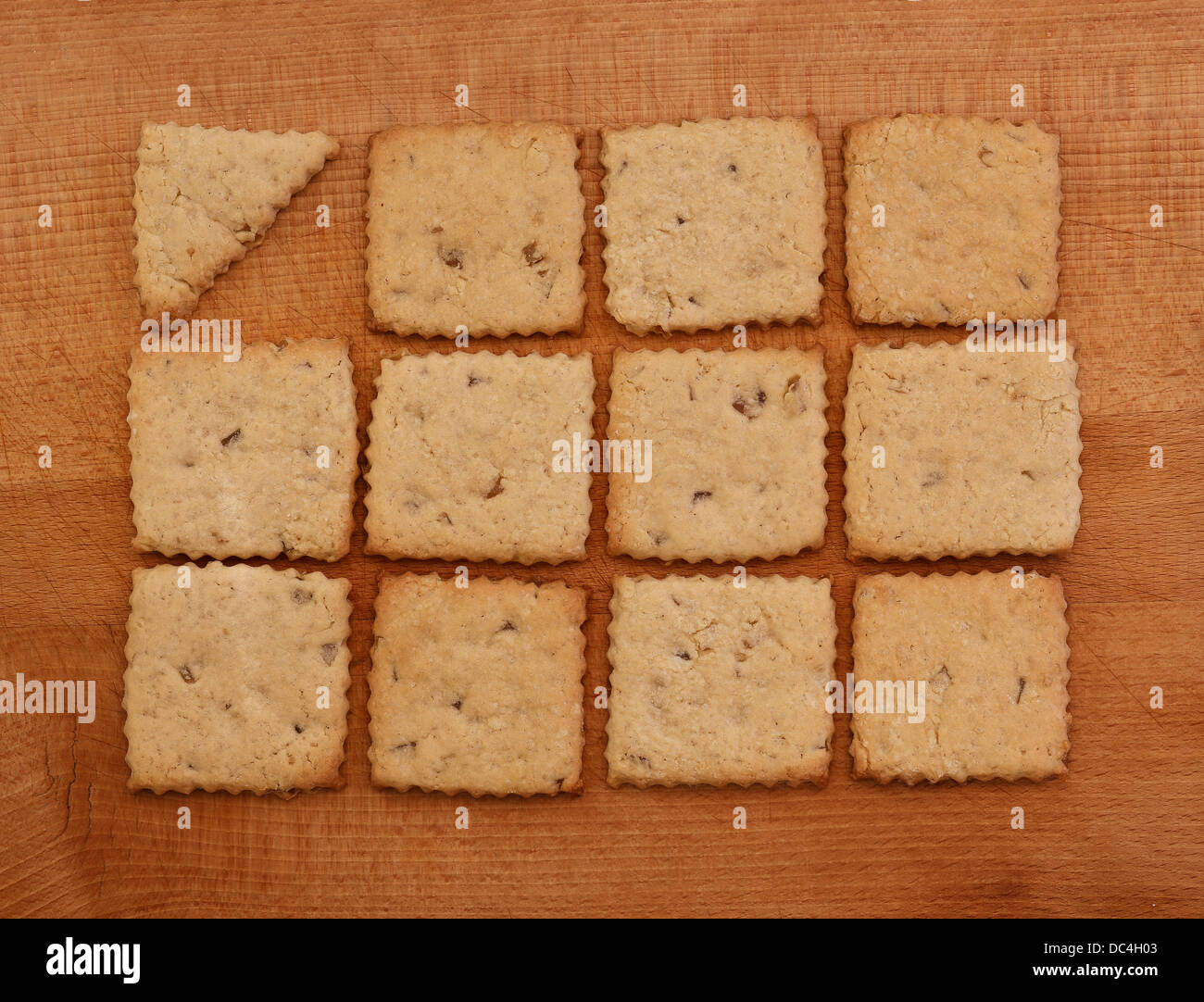 Square shaped ginger cookies stacked on wooden board Stock Photo - Alamy