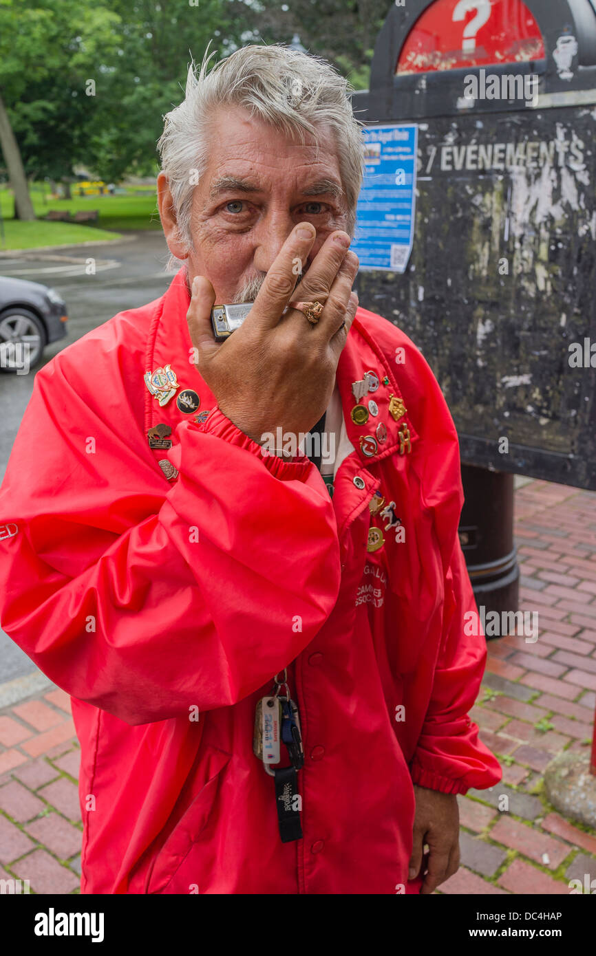 Homeless man playing harmonica on hi-res stock photography and images ...