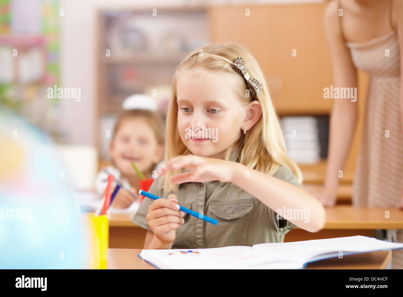 Little girl at school class Stock Photo - Alamy
