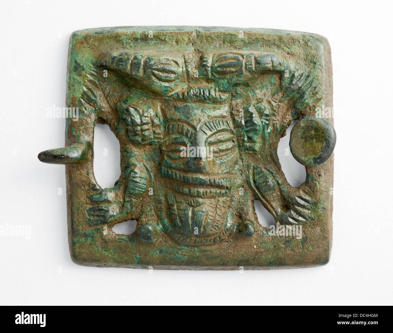 This ancient belt buckle, shaped like a human head, is part of the ...