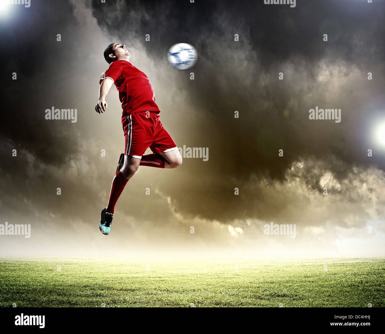 football player striking the ball Stock Photo - Alamy