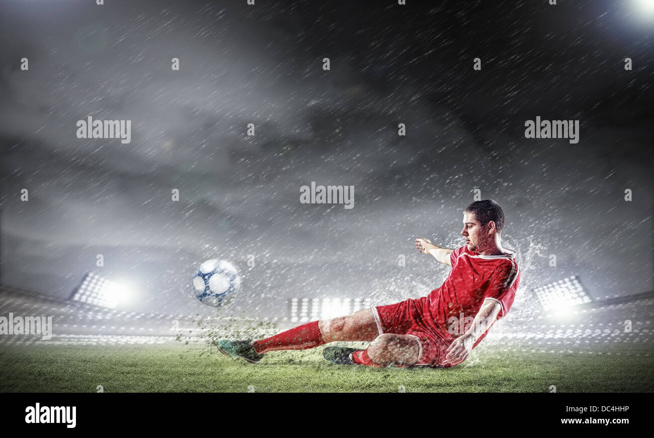 football player striking the ball Stock Photo - Alamy
