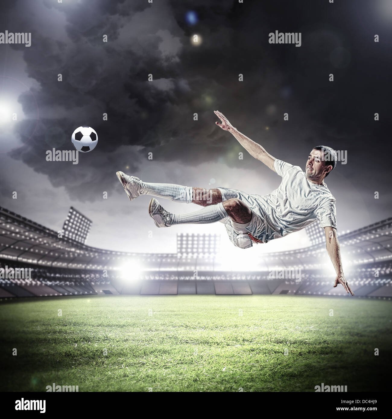 football player striking the ball Stock Photo - Alamy