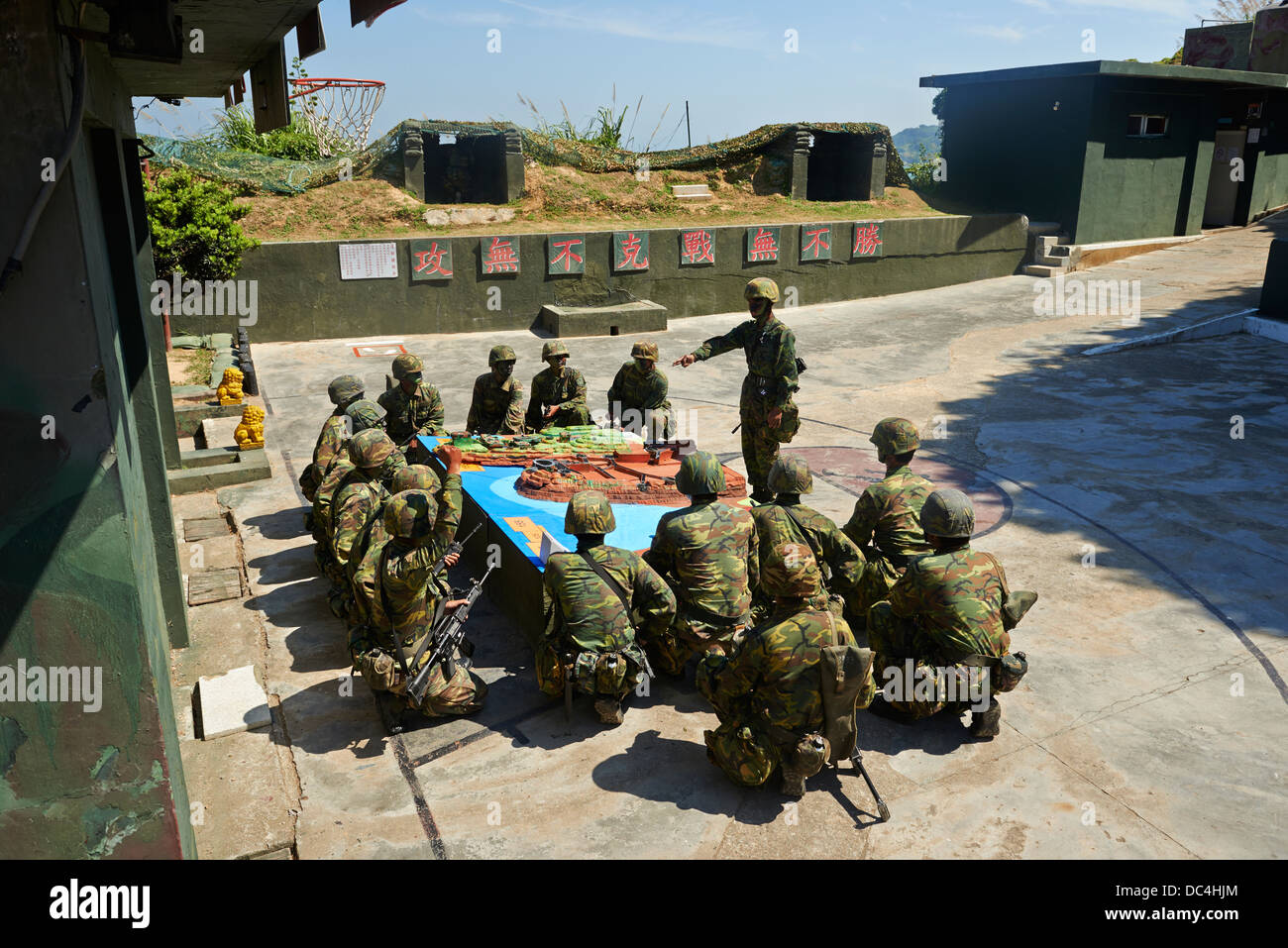 A troop of Taiwanese soldiers practice war games as part of standard ...