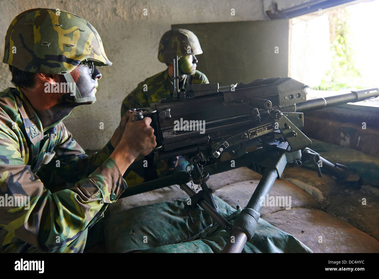 A troop of Taiwanese soldiers practice war games as part of standard ...