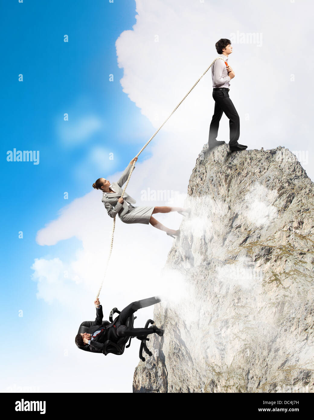 Three business people pulling rope Stock Photo - Alamy
