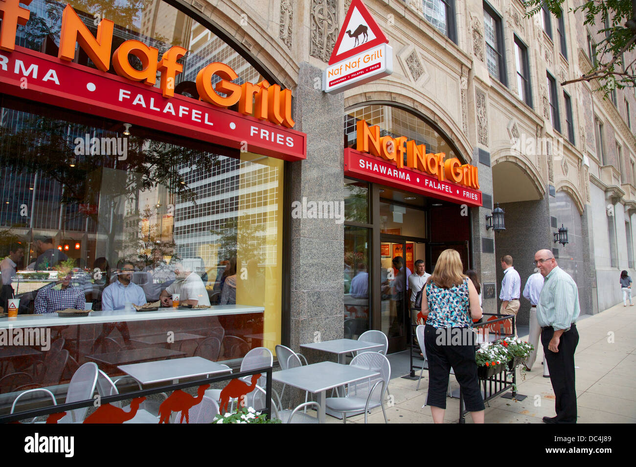 Patrons standing in queue outside Naf Naf Grill Middle Eastern ...
