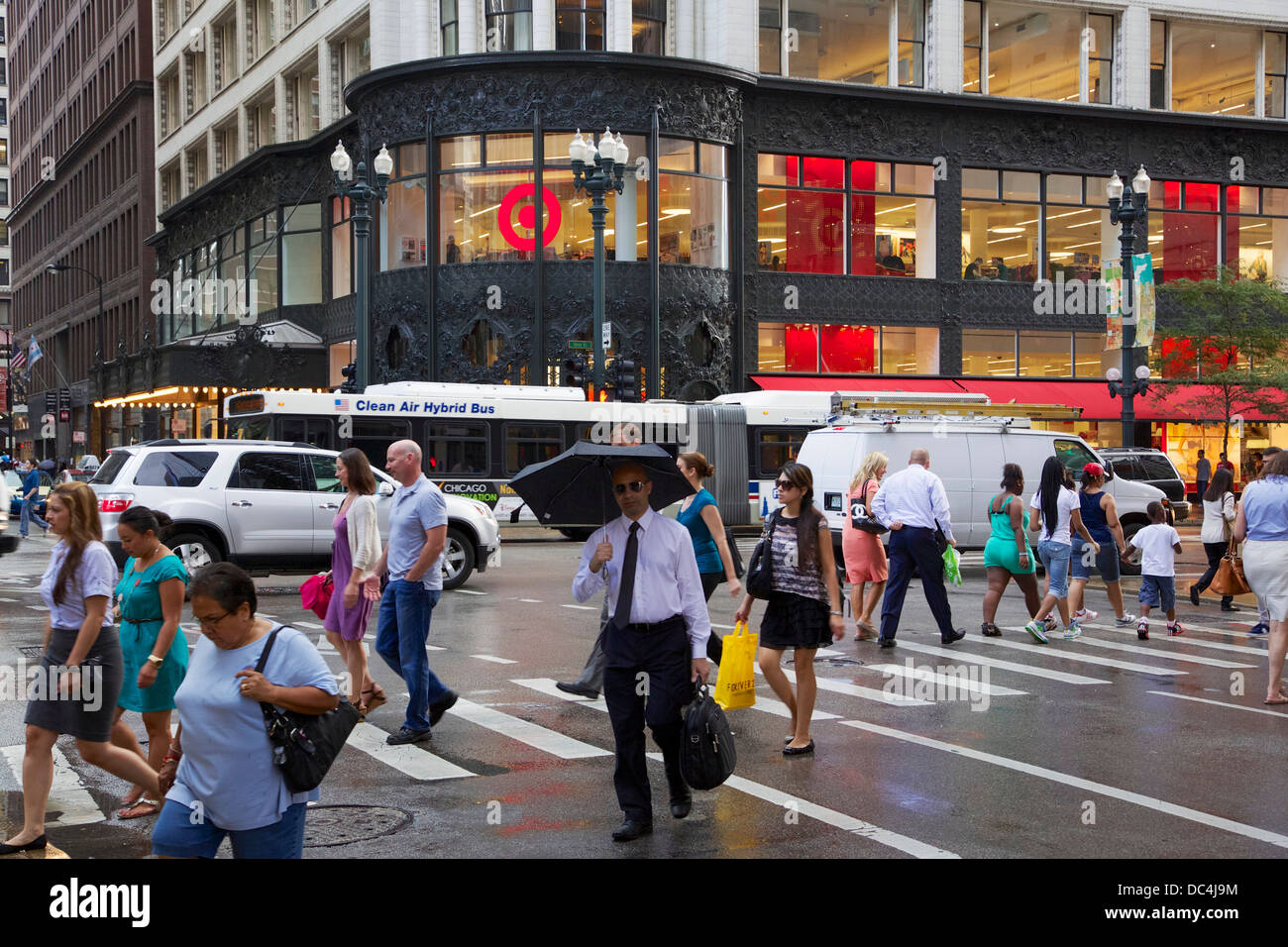 State and Washington Streets Chicago on a rainy day, man with umbrella ...