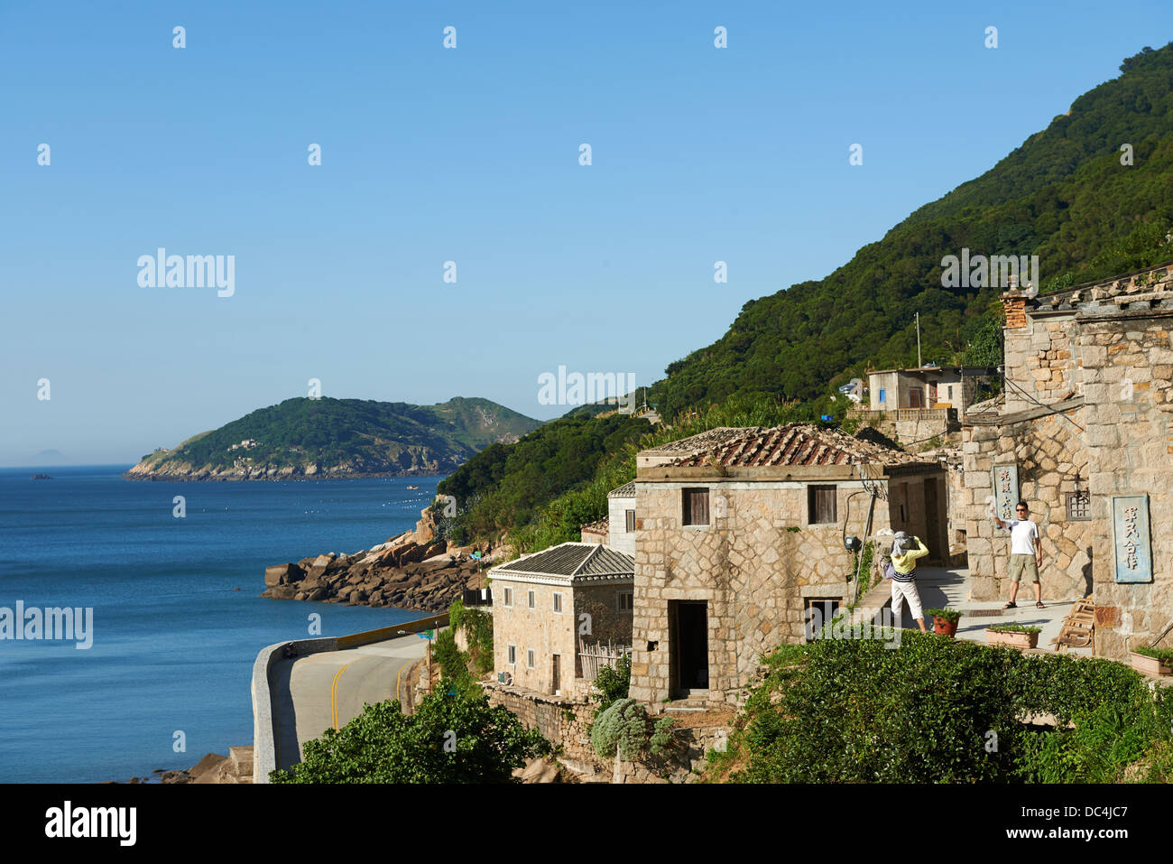 Tourists visit the Chinbe Village, a 19th century village containing ...