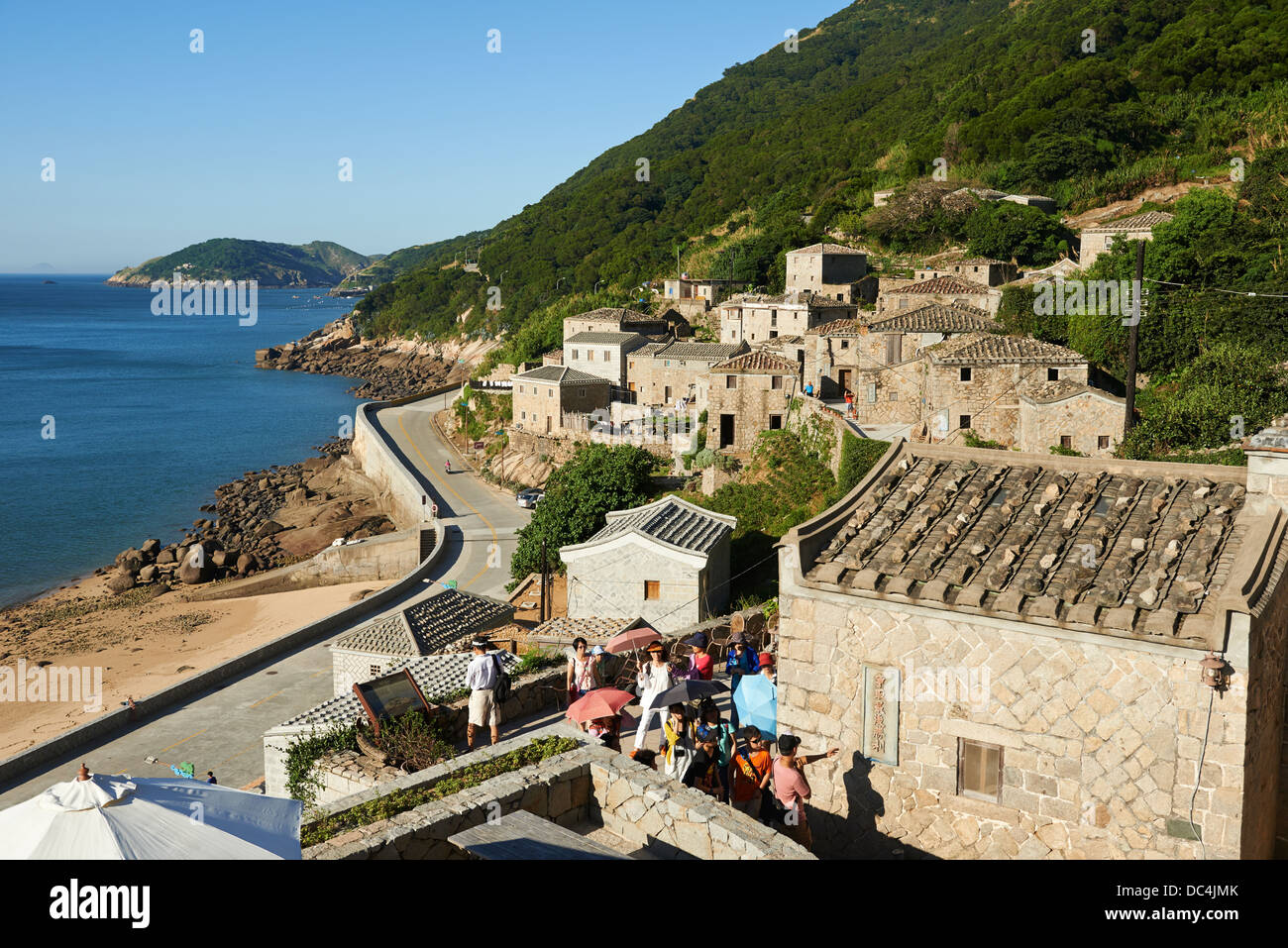 Tourists visit the Chinbe Village. a 19th century village containing ...