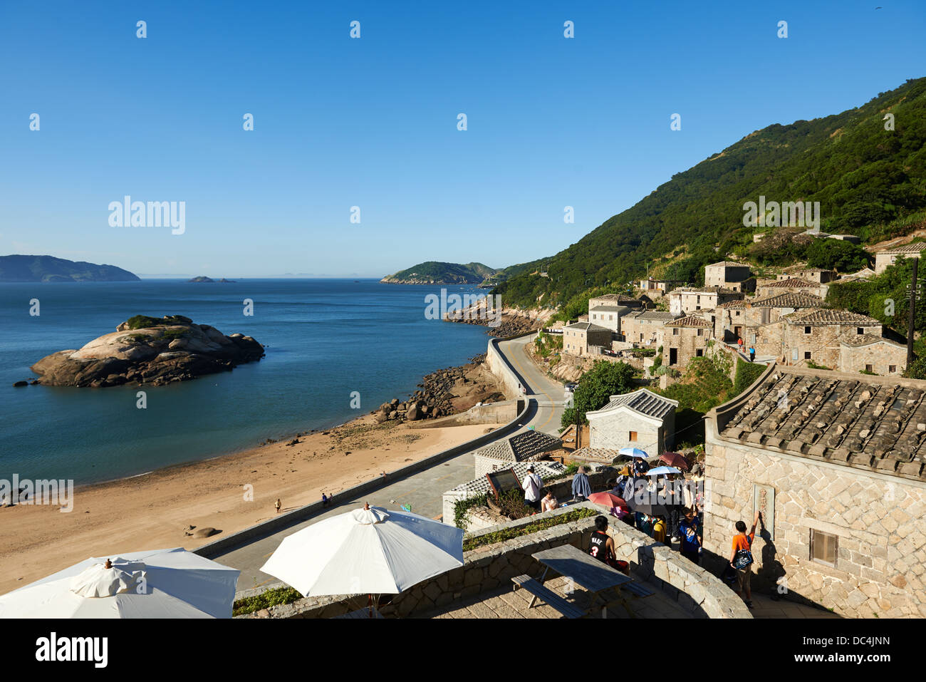 Tourists visit the Chinbe Village. a 19th century village containing ...