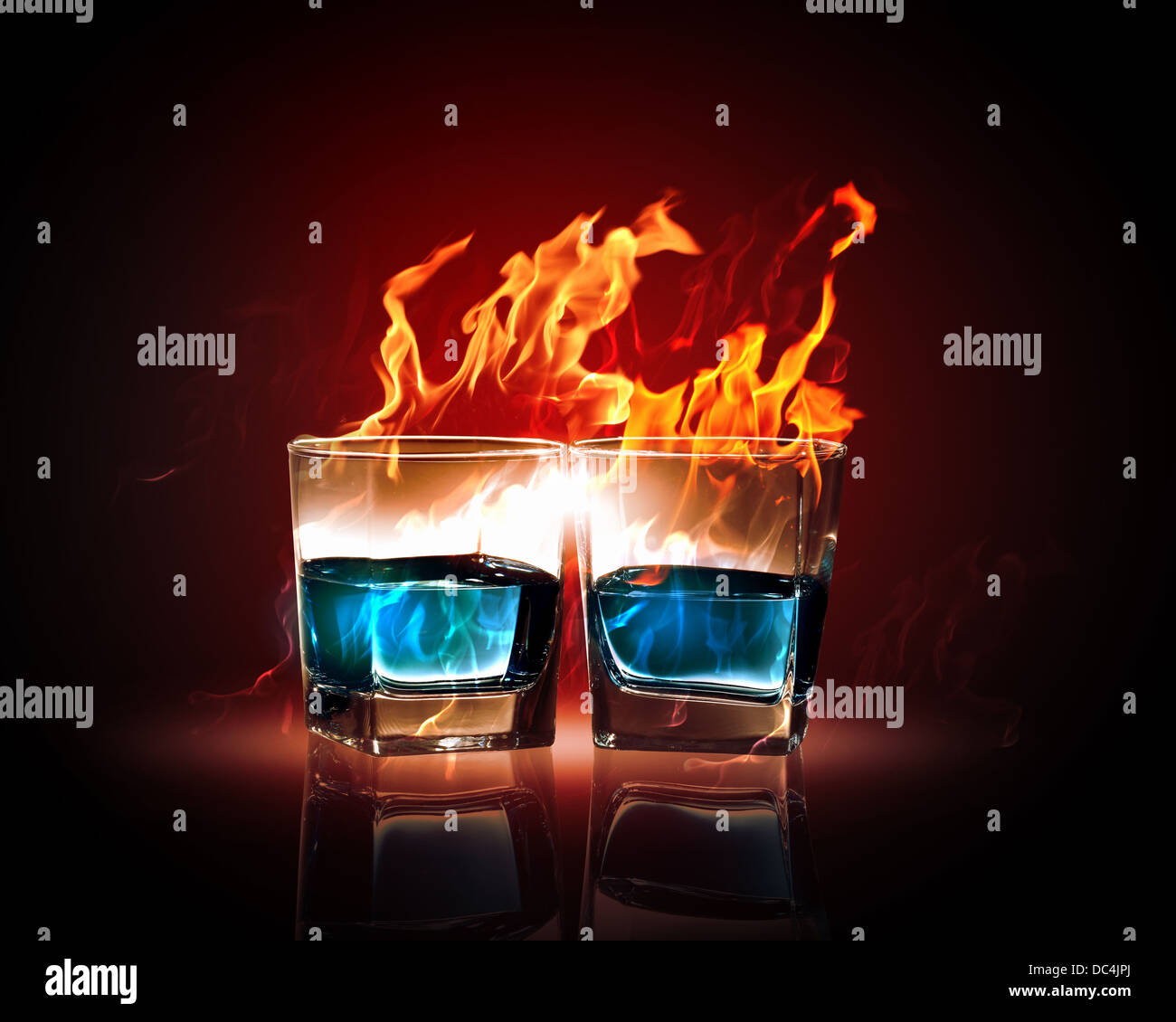 Two glasses of burning emerald absinthe Stock Photo - Alamy
