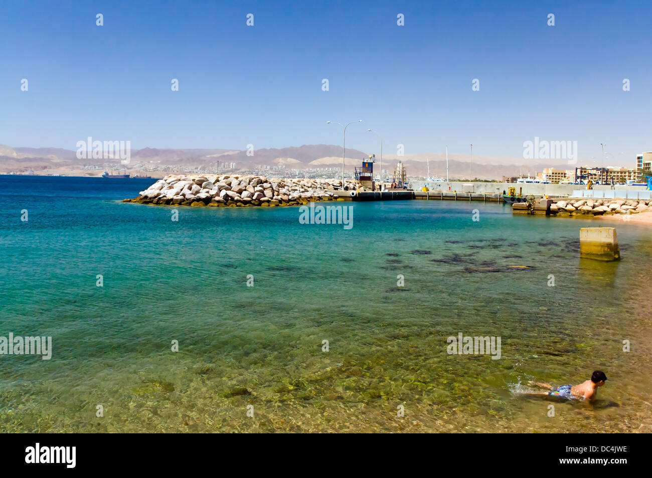 Red Sea turquoise clear water on beach of Aqaba, Jordan Stock Photo - Alamy
