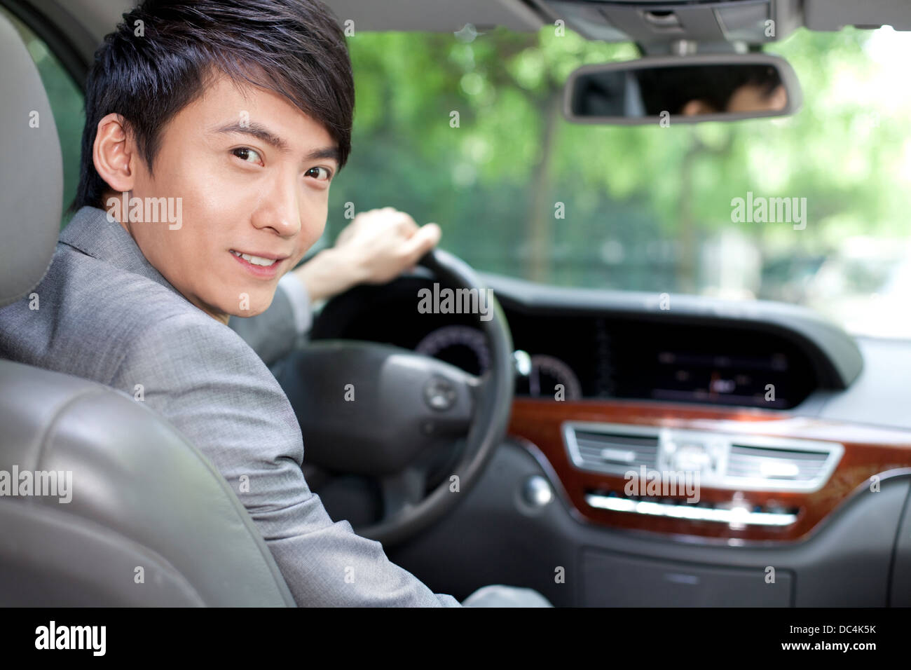 Businessman inside car Stock Photo - Alamy