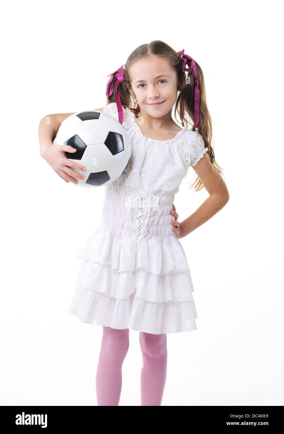 Pretty young girl holding a soccer ball Stock Photo - Alamy