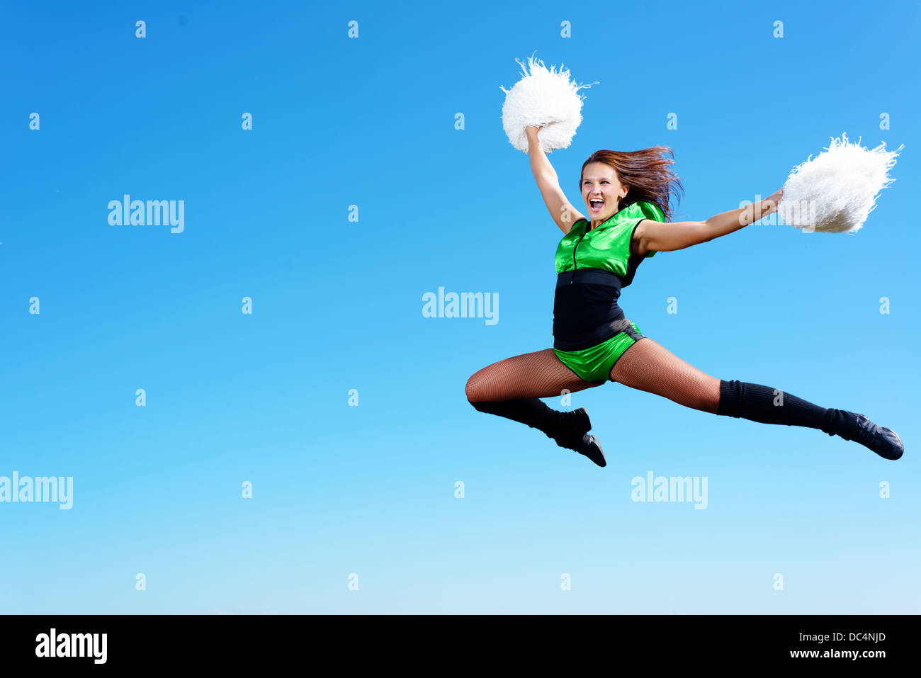 cheerleader girl jumping Stock Photo - Alamy