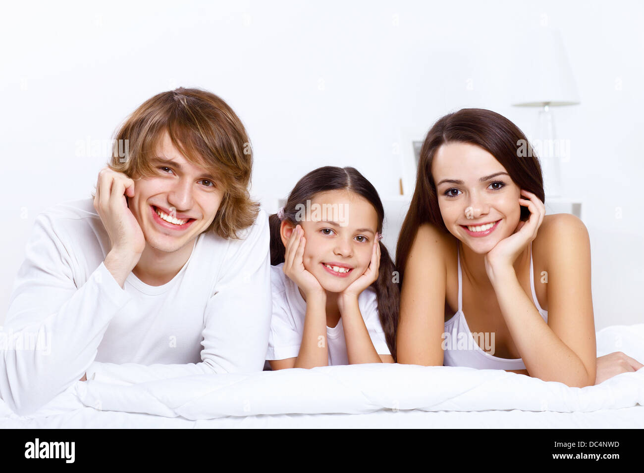 Family at home Stock Photo - Alamy