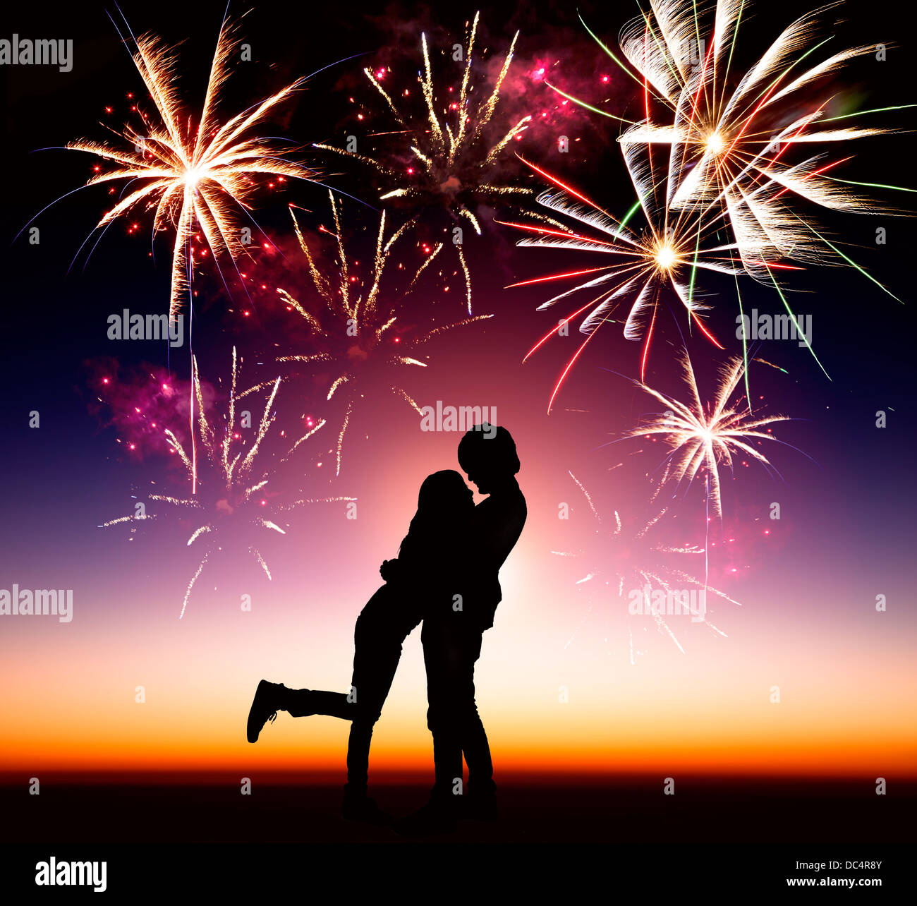 happy young couple with fireworks background Stock Photo - Alamy