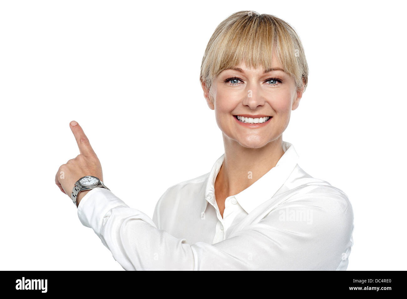 Corporate lady pointing backwards Stock Photo - Alamy