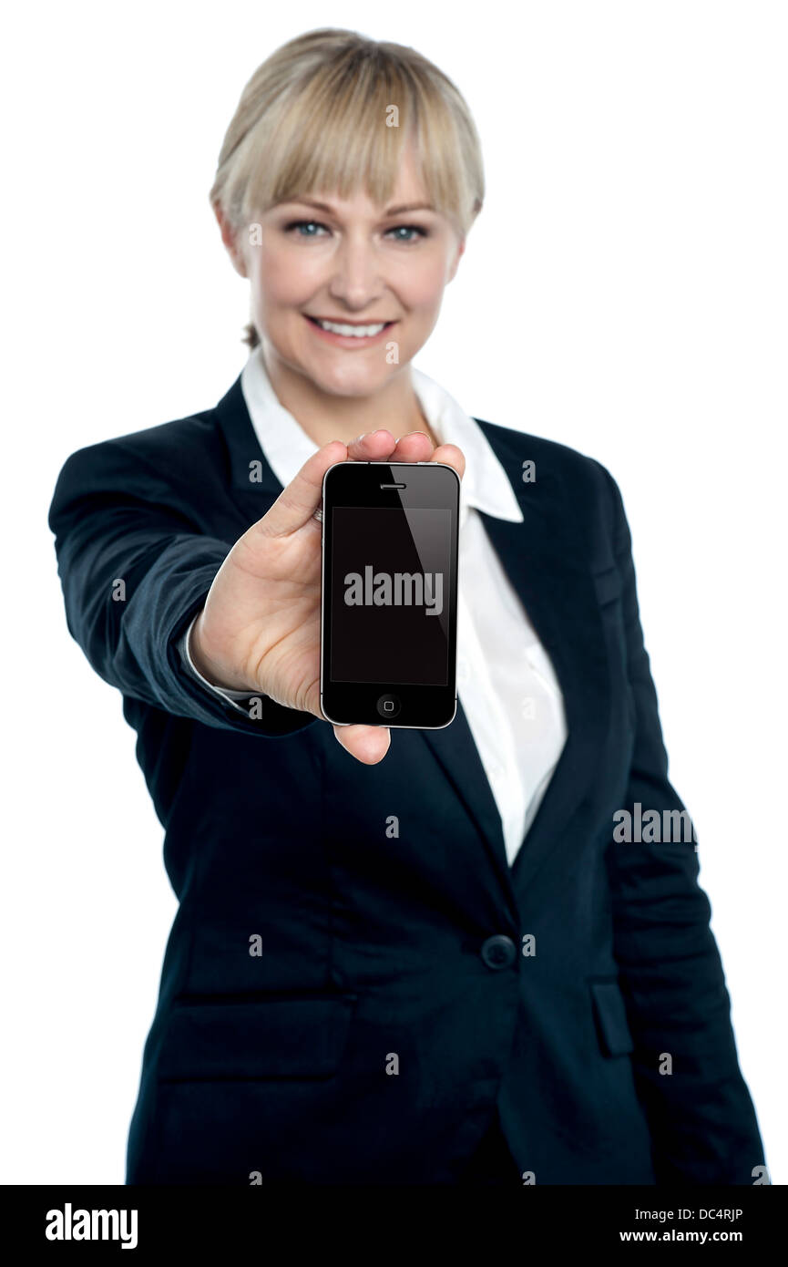 Sales executive displaying brand new multimedia phone Stock Photo - Alamy