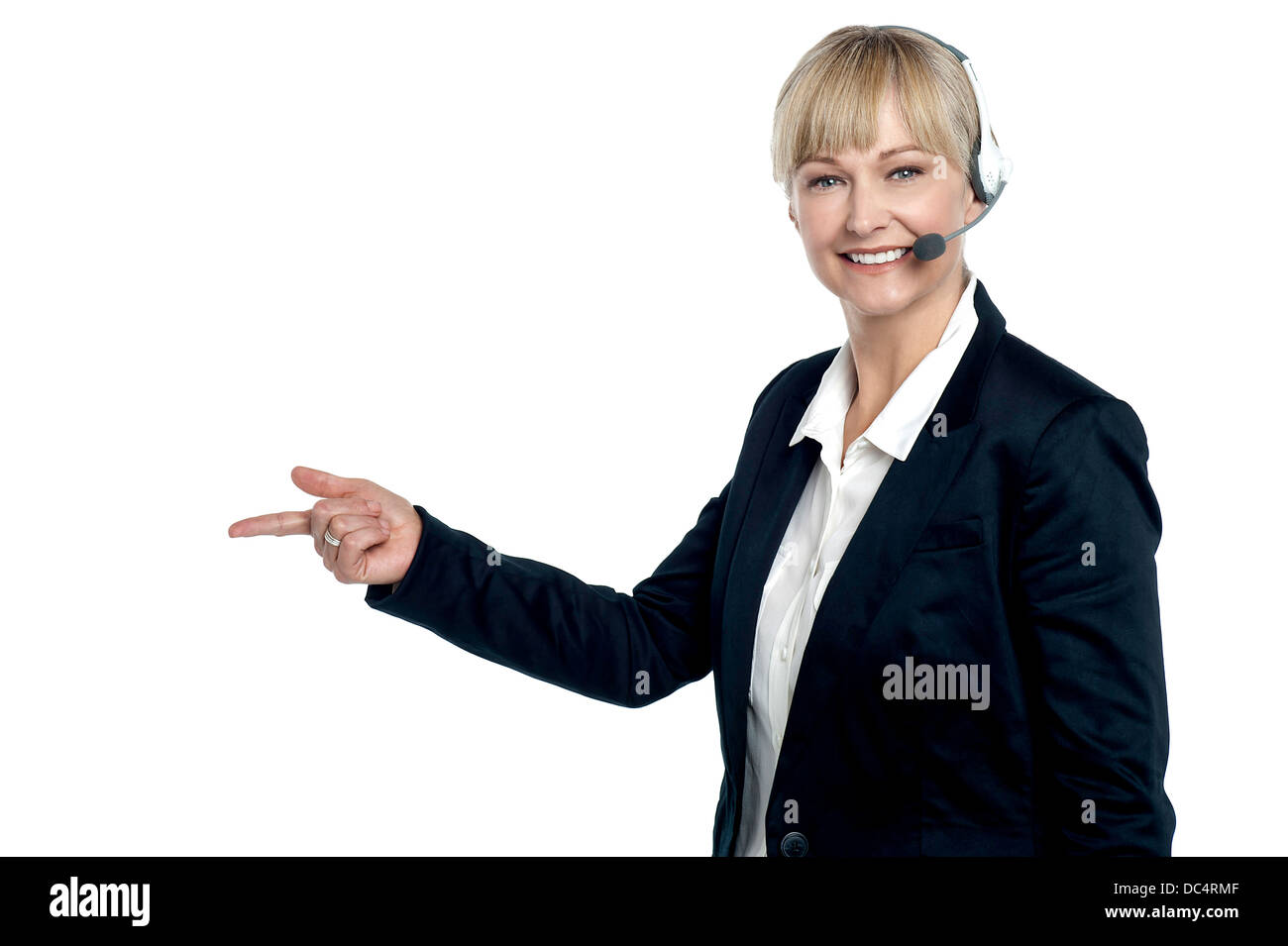 Woman pointing finger side wearing Cut Out Stock Images & Pictures - Alamy