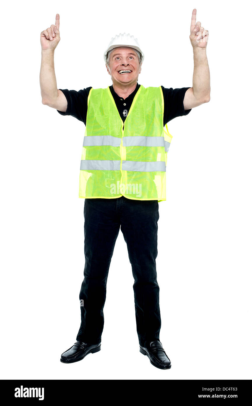 Experienced construction employee pointing his fingers upwards Stock ...