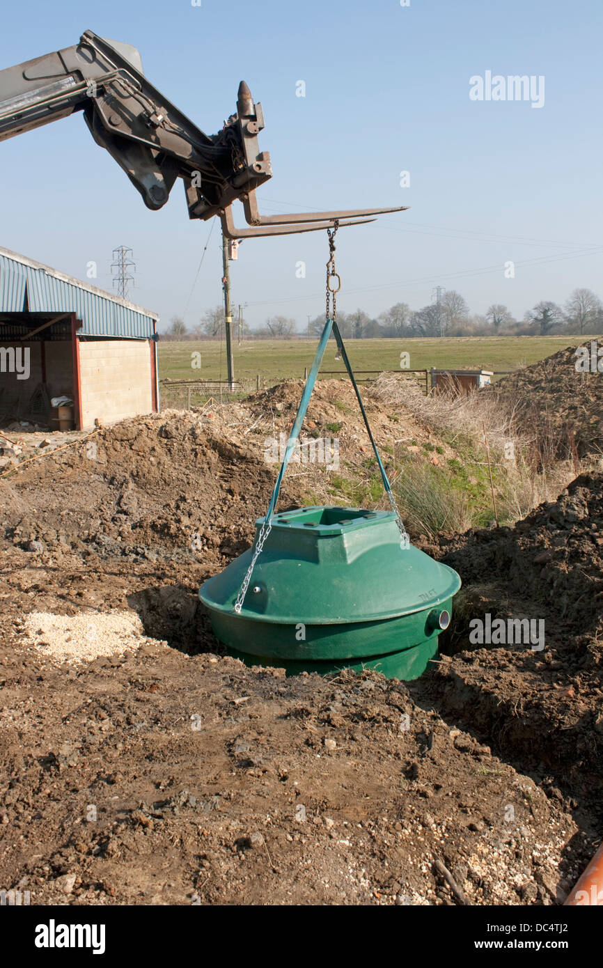 Telescopic handler lifting BioPure septic tank into position UK Stock ...