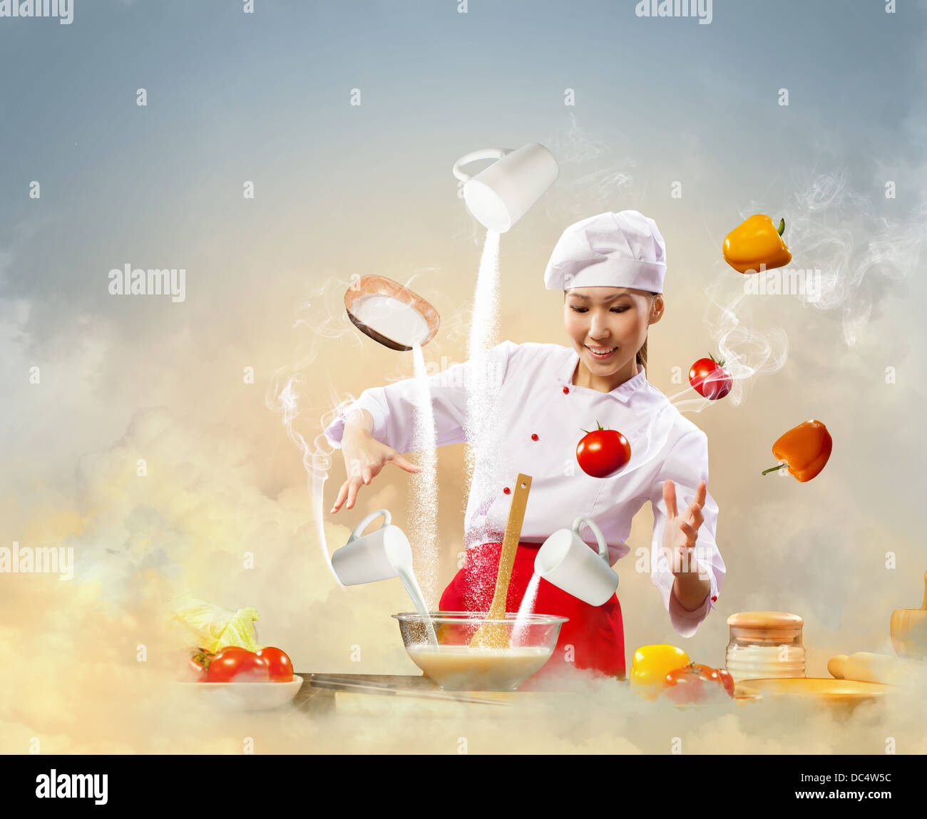 Asian female cooking with magic Stock Photo - Alamy